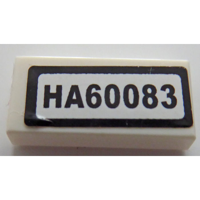 LEGO Tile 1 x 2 with Black 'HA60083' Sticker with Groove (3069) | Brick ...
